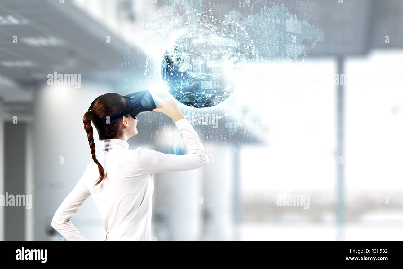 Experiencing virtual technology world. Mixed media Stock Photo - Alamy