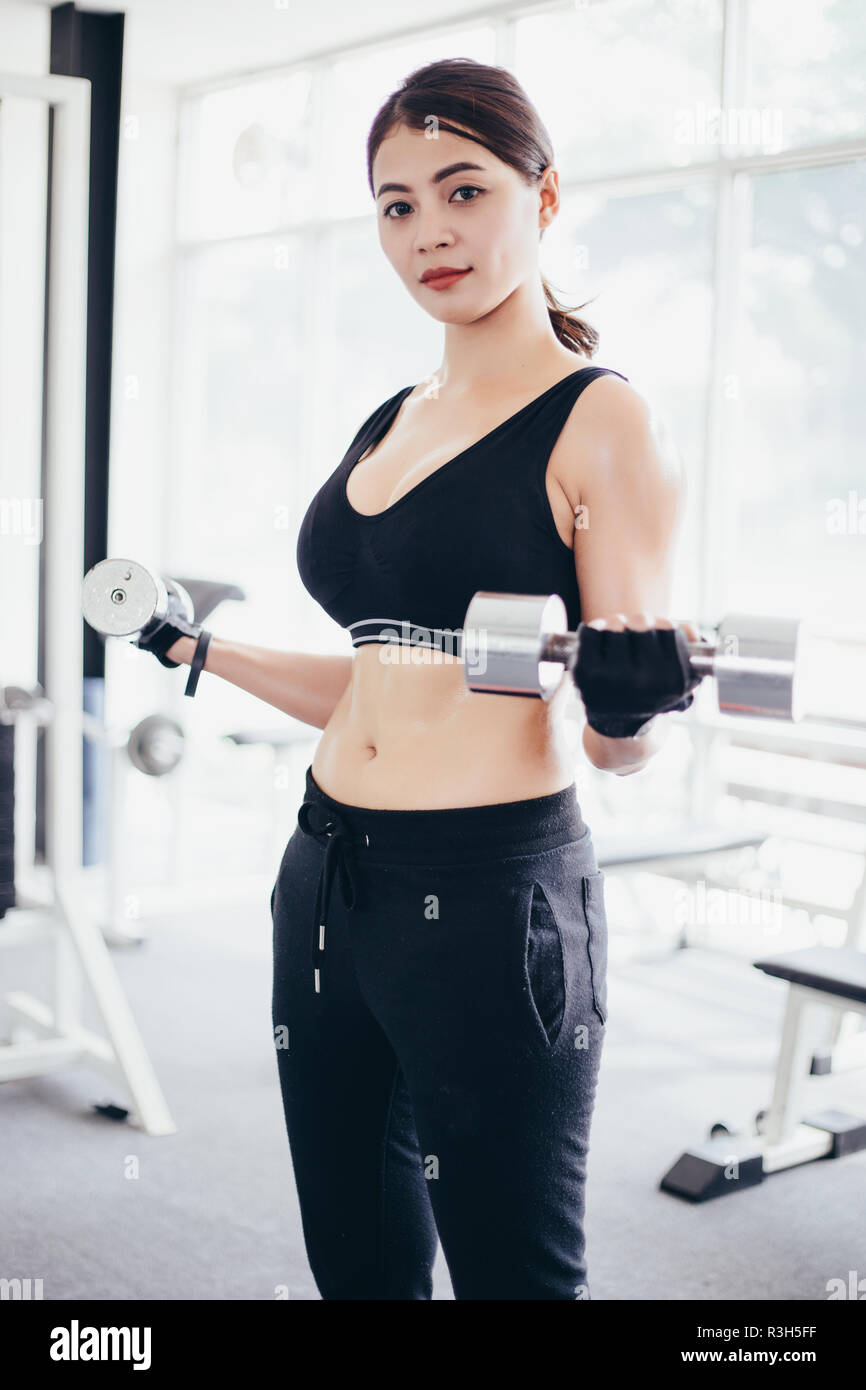 beautiful muscular fit woman exercising building muscles and fitness ...