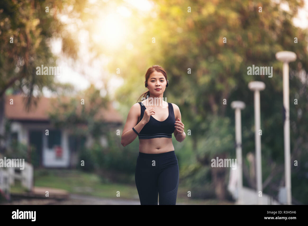 Running woman. Female runner jogging during outdoor on road .Young ...