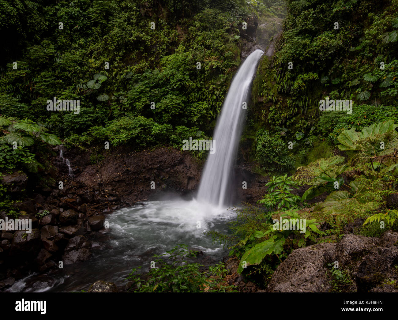 Scenic landscape with a waterfall Stock Photo - Alamy