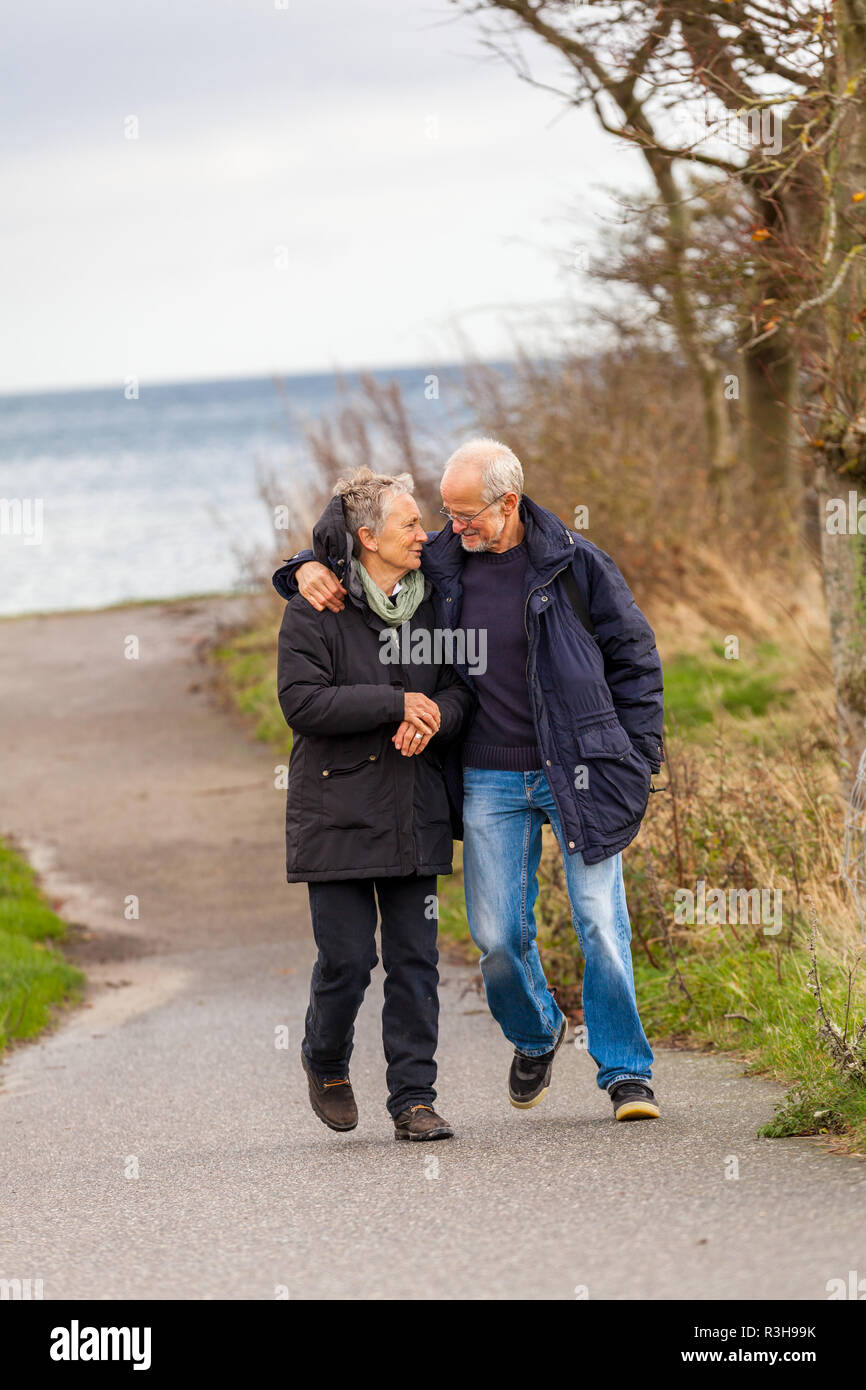 senior happy couple taking a walk Stock Photo - Alamy