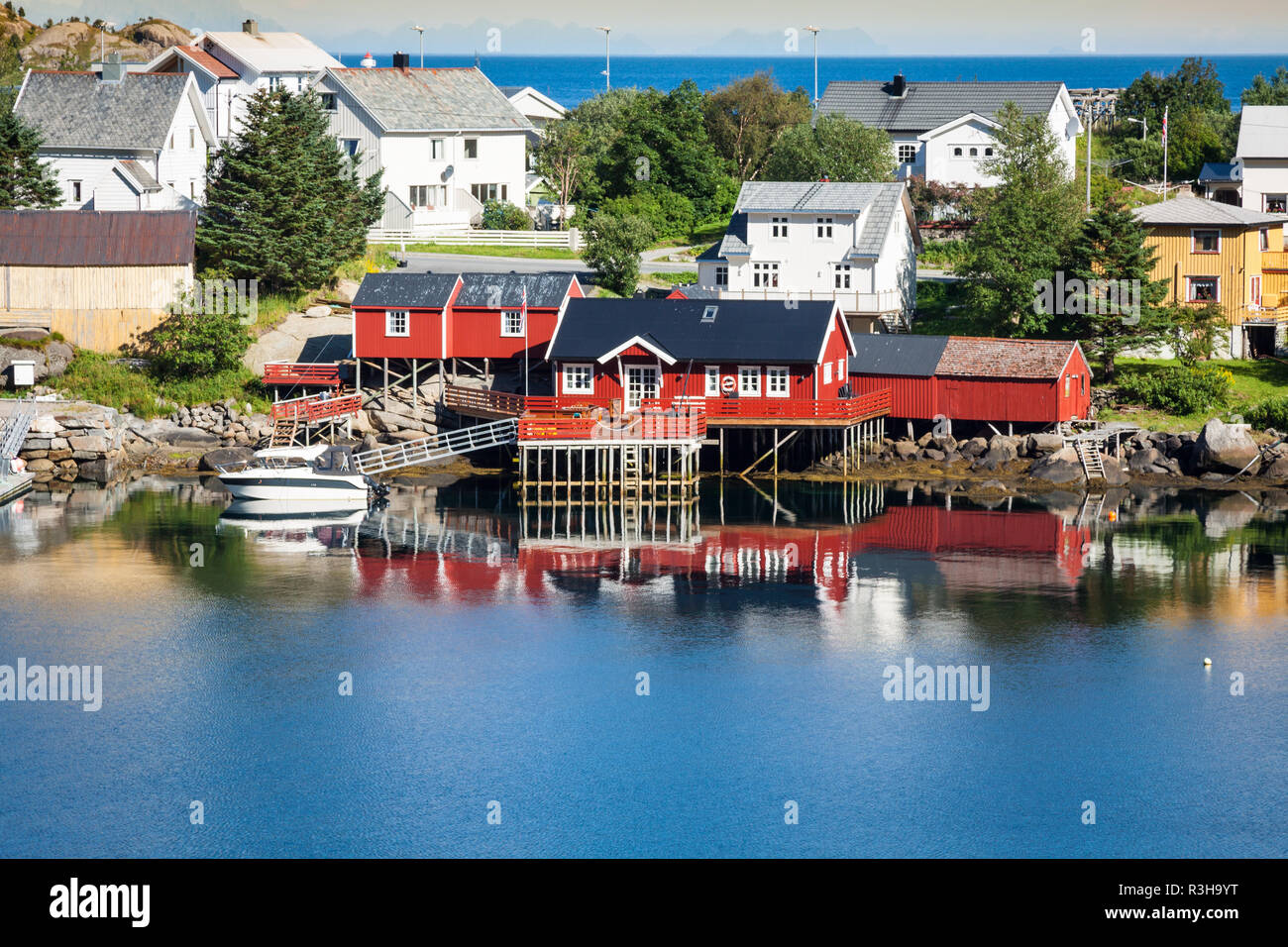 typical norwegian fishing village with traditional red rorbu huts,reine ...