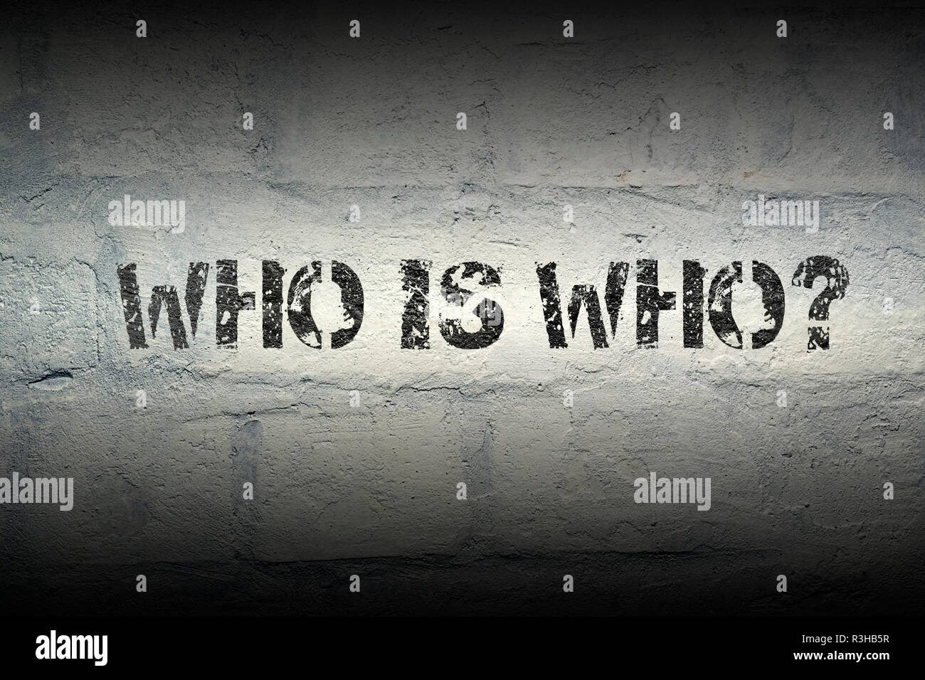 who is who question stencil print on the grunge white brick wall Stock ...