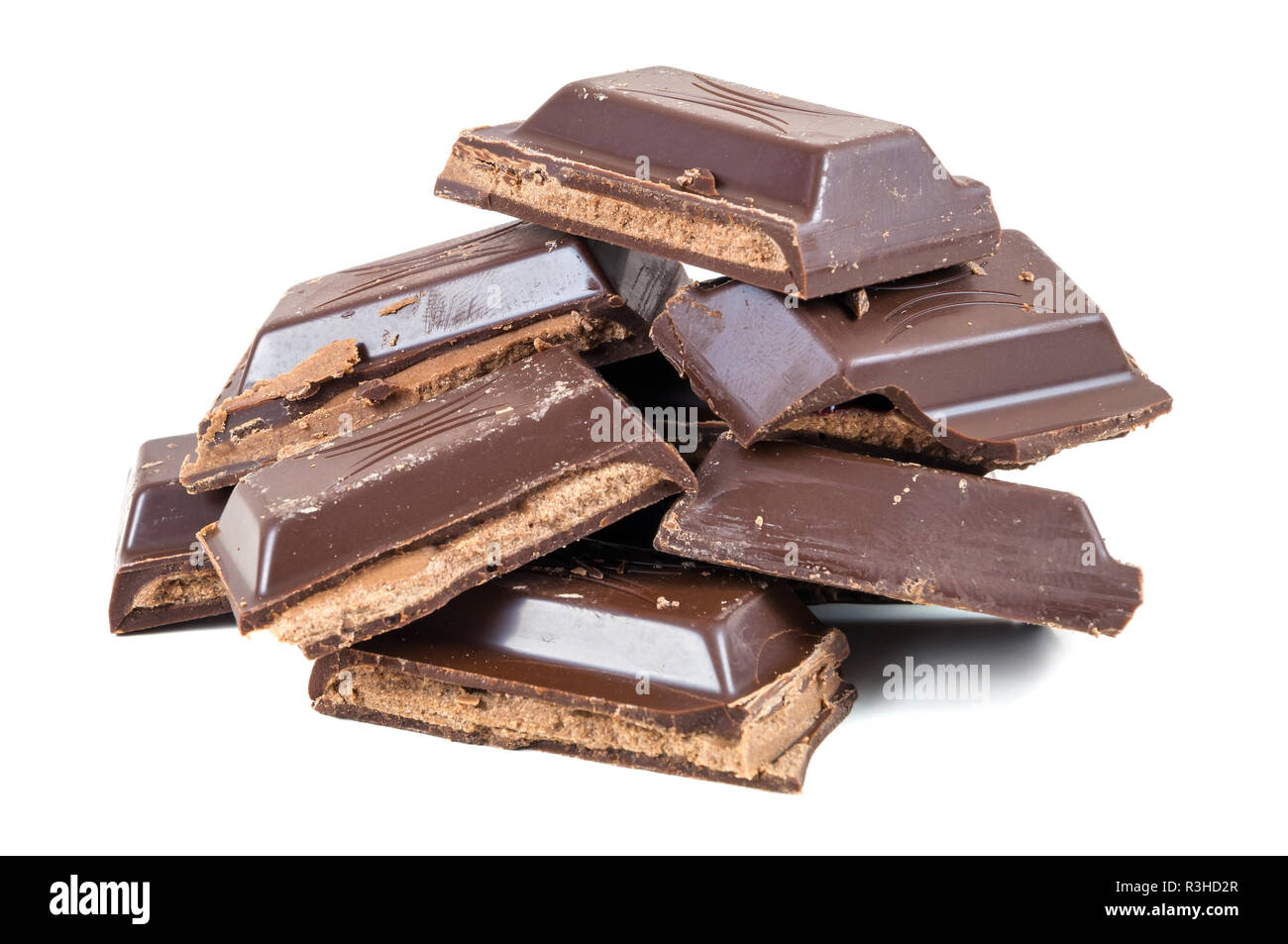 heap of chocolate pieces on white background Stock Photo - Alamy