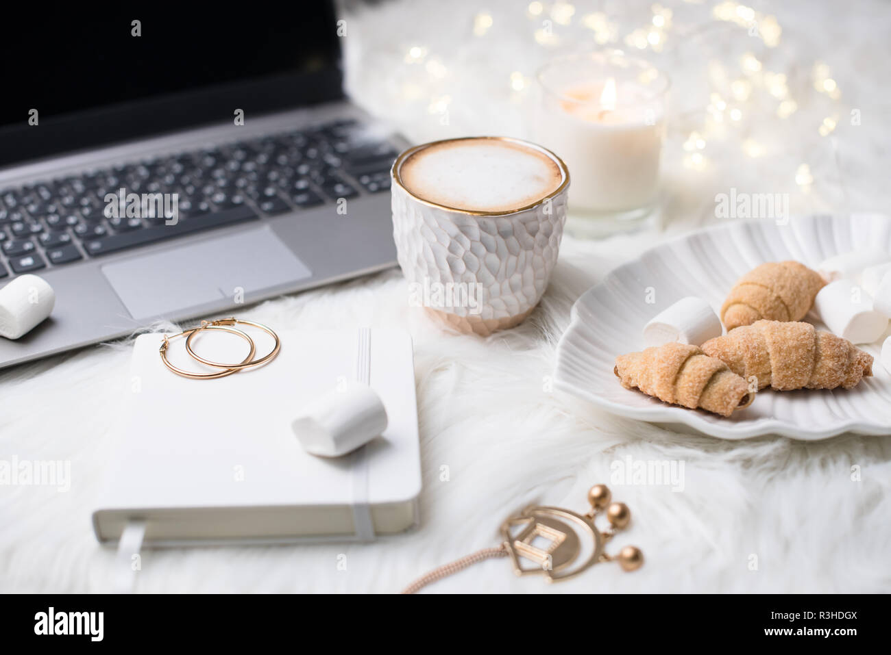 Lady bloggers white work place with business details, laptop, coffee ...