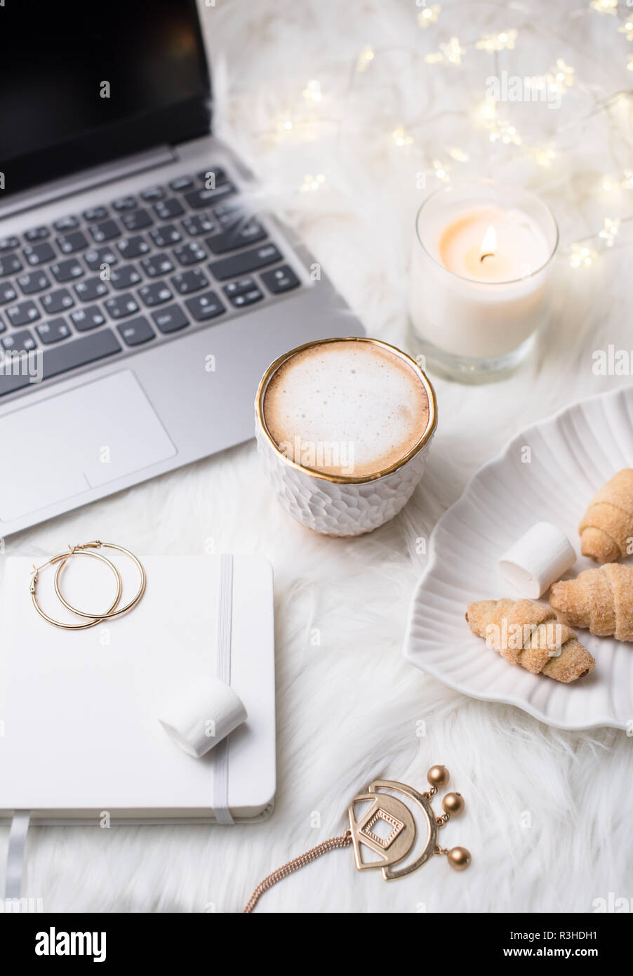 Lady bloggers white work place with business details, laptop, coffee ...