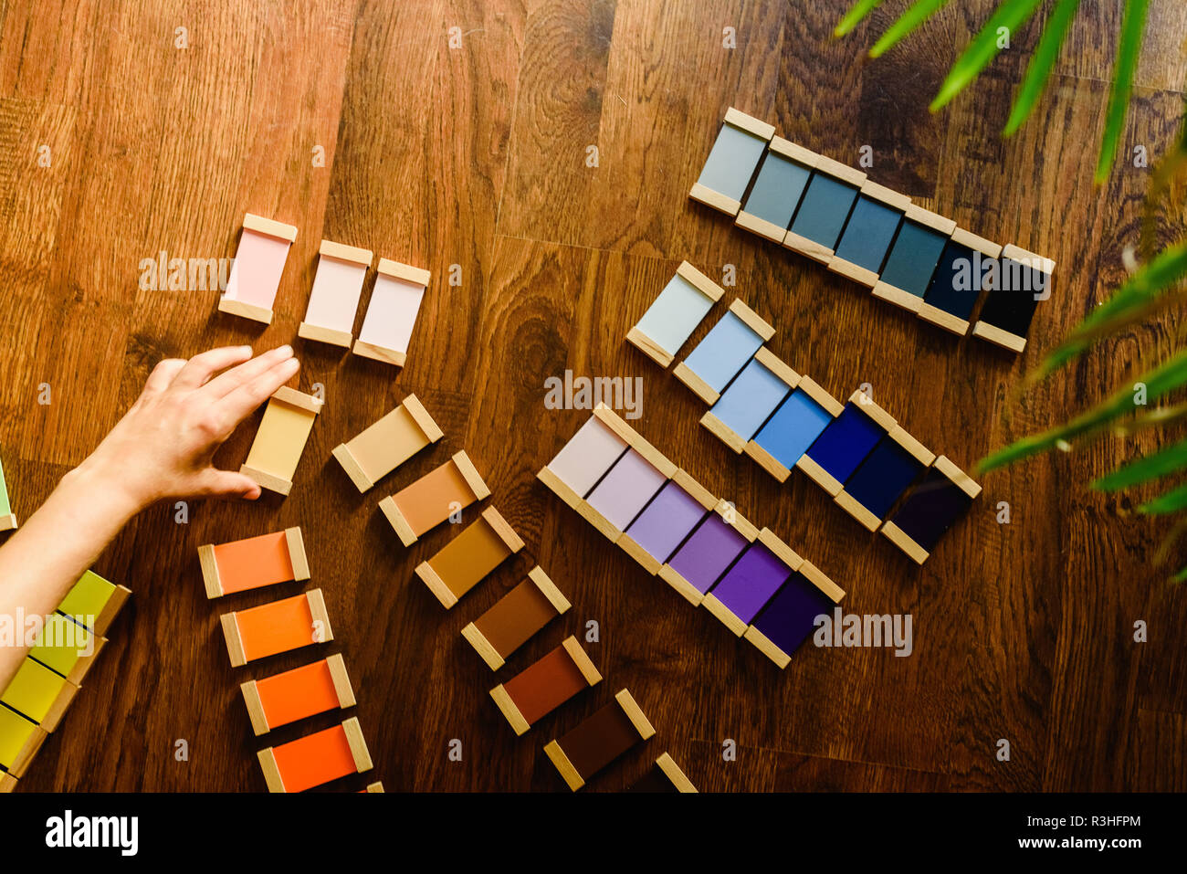 Children playing and learning with montessori color tablets Stock Photo ...