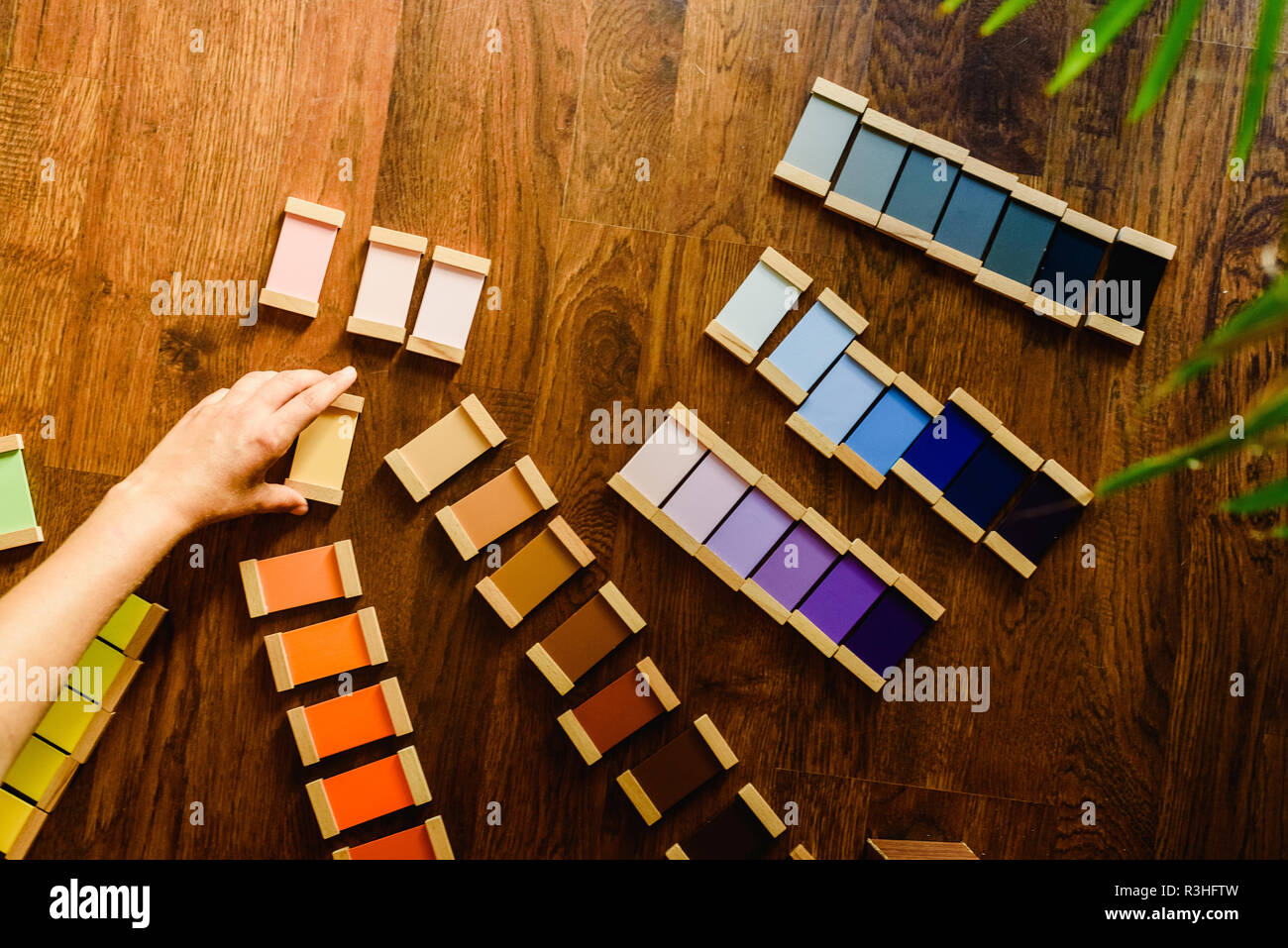 Children playing and learning with montessori color tablets Stock Photo ...