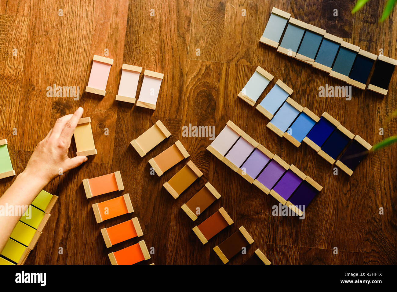 Children playing and learning with montessori color tablets Stock Photo ...