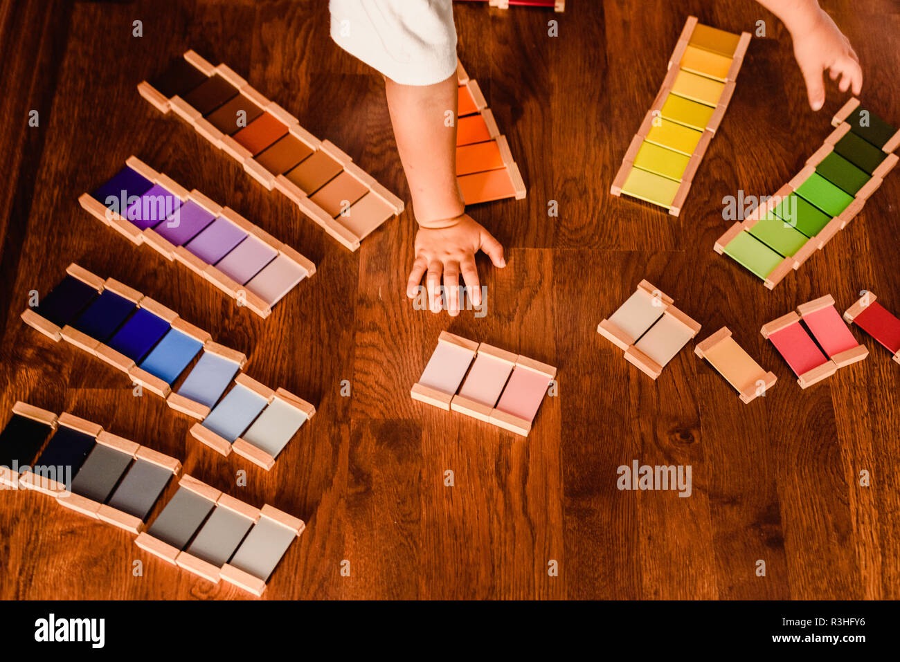 Children playing and learning with montessori color tablets Stock Photo ...
