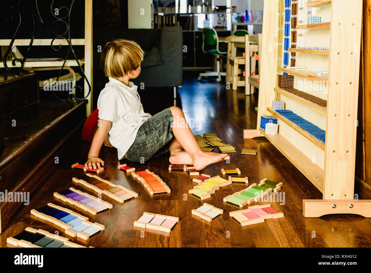 Children playing and learning with montessori color tablets Stock Photo ...