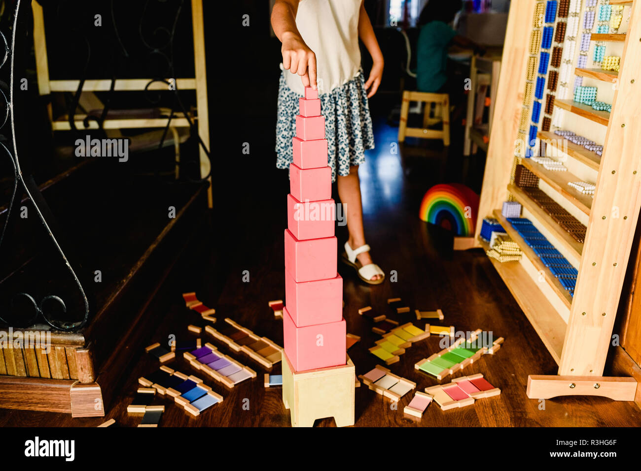 Children playing with pink tower in a Montessori class Stock Photo - Alamy