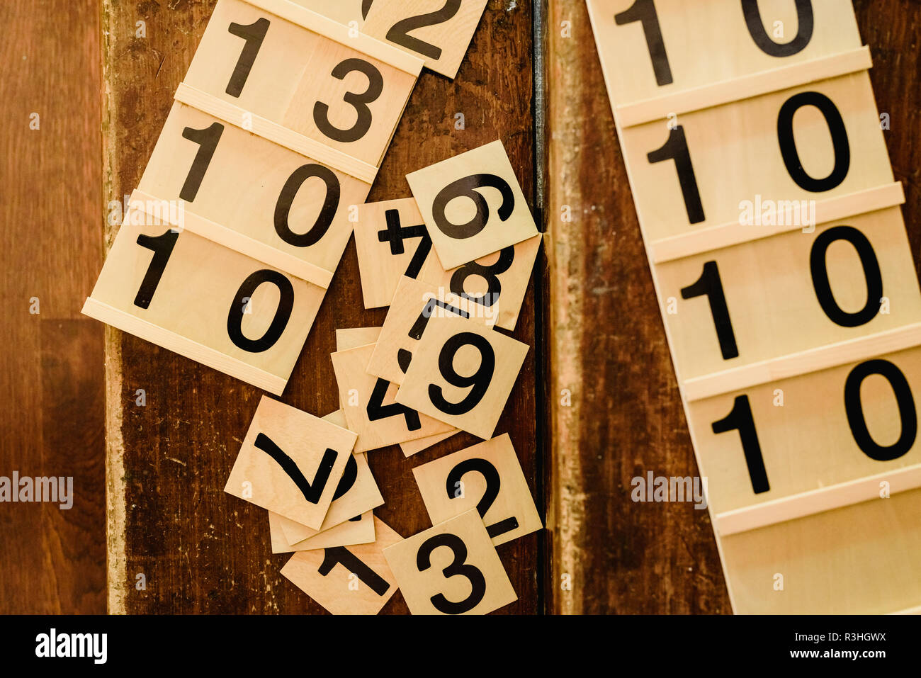 Wooden numbers in tables to learn mathematics in a Montessori classroom ...