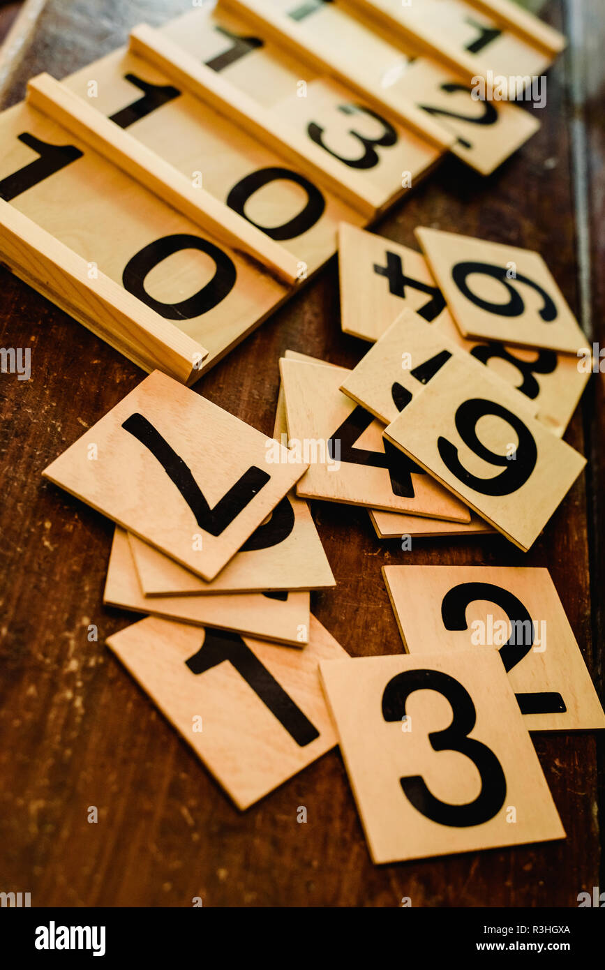 Wooden numbers in tables to learn mathematics in a Montessori classroom ...