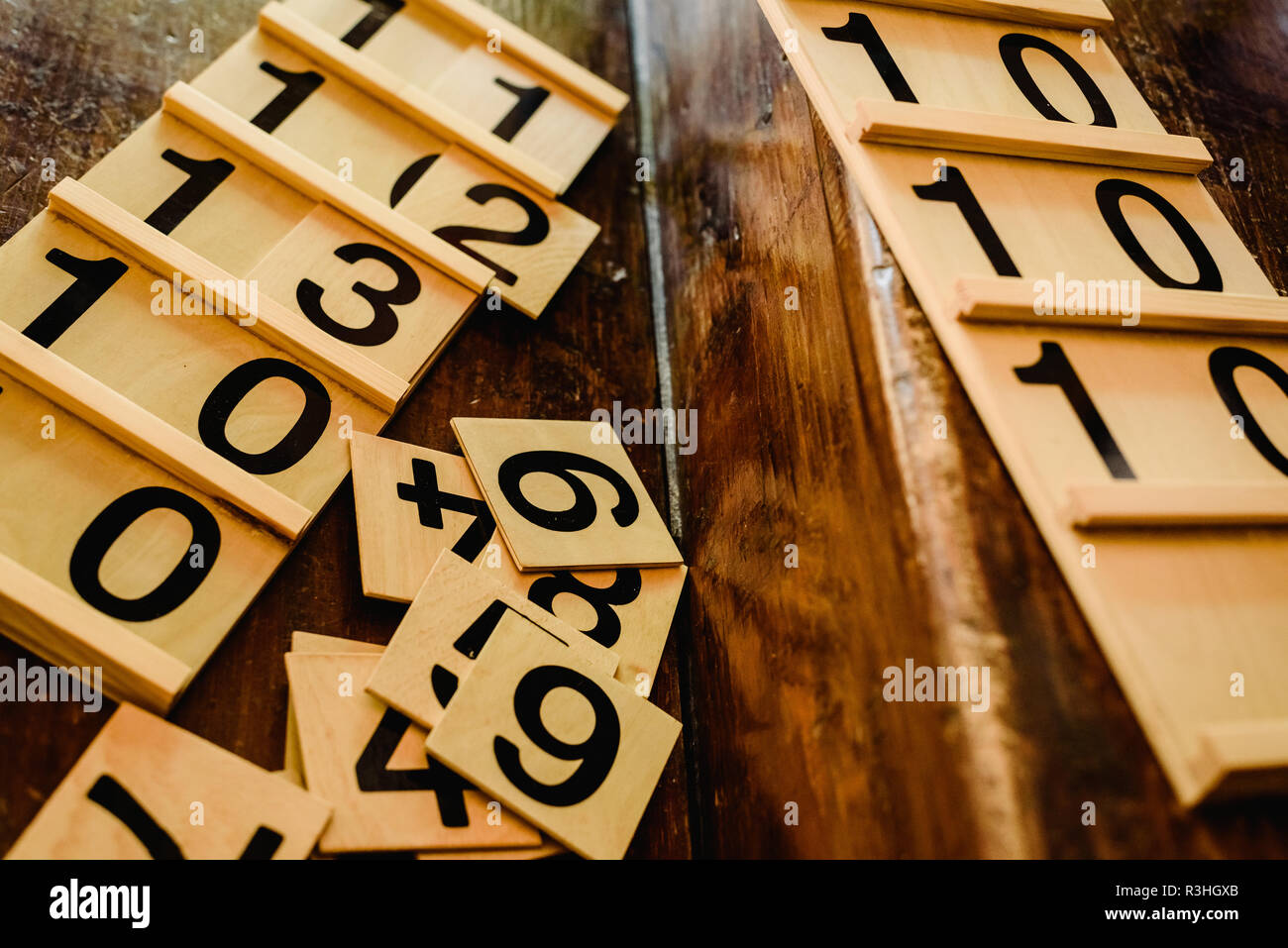 Wooden numbers in tables to learn mathematics in a Montessori classroom ...