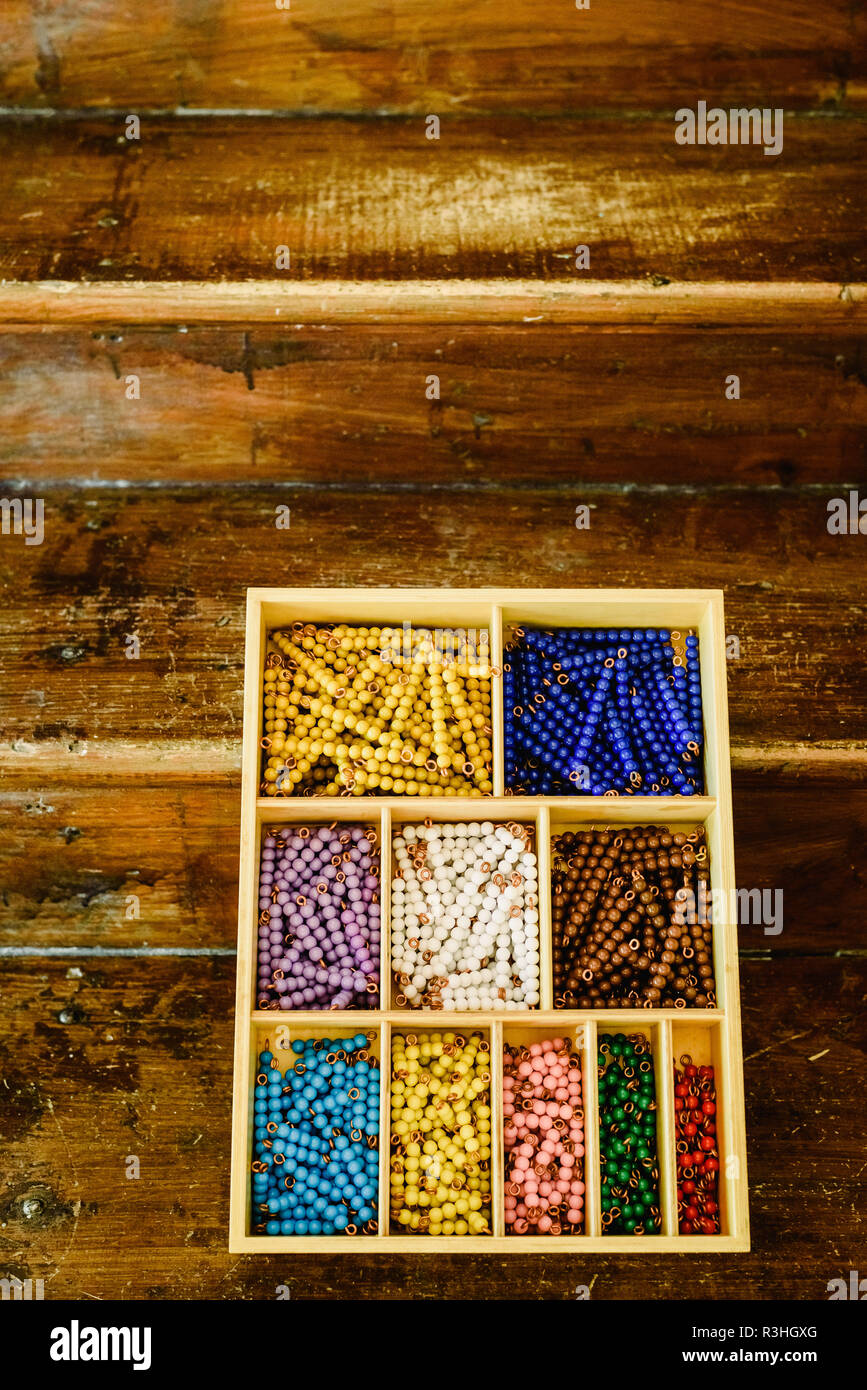 Color bead stairs, counting in a montessori classroom Stock Photo - Alamy