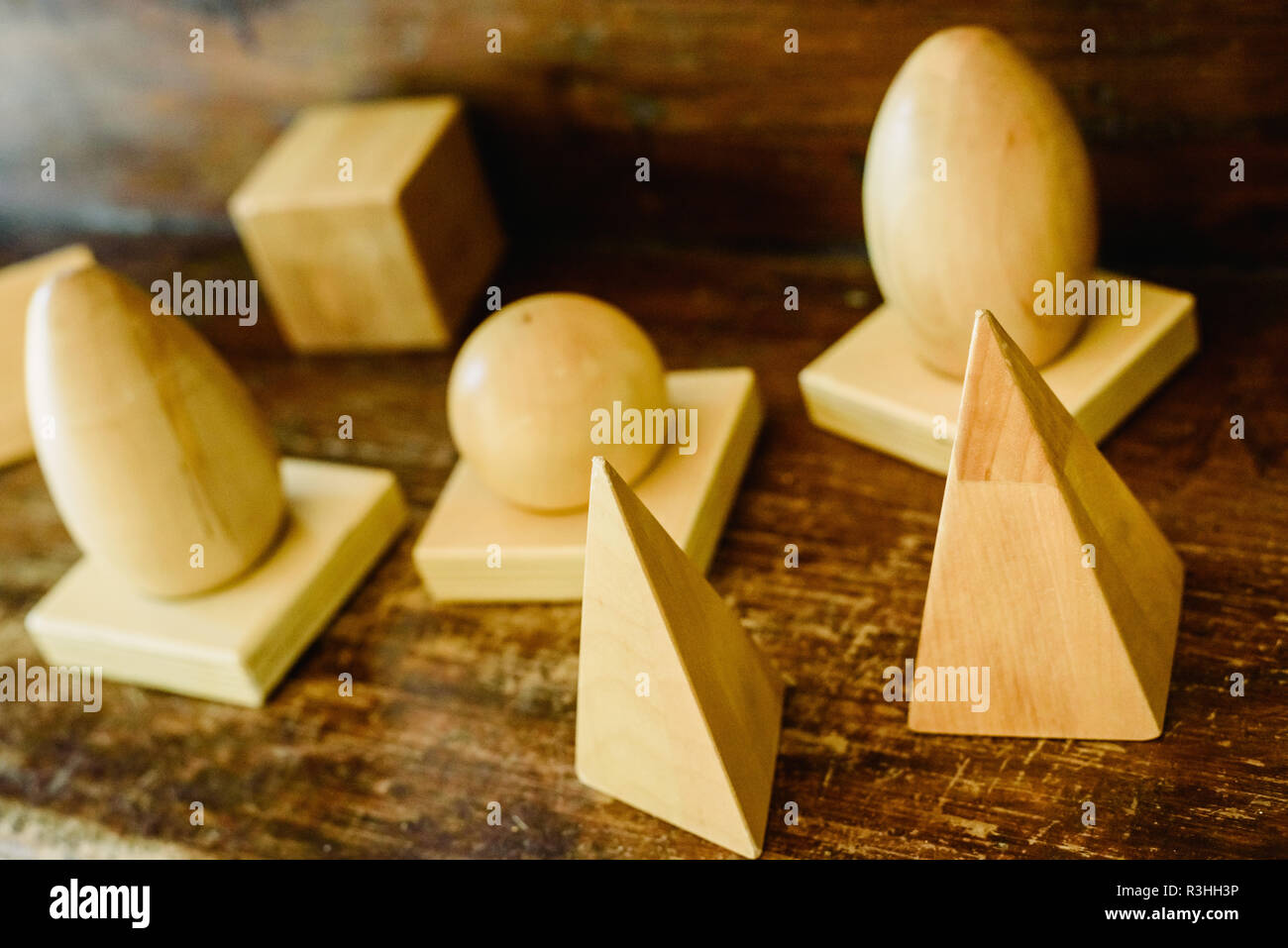 Solid wood shapes to study geometry and volumes, cones, triangles ...