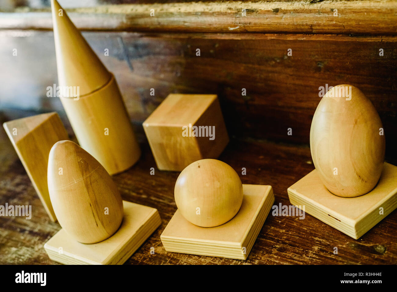 Solid wood shapes to study geometry and volumes, cones, triangles ...