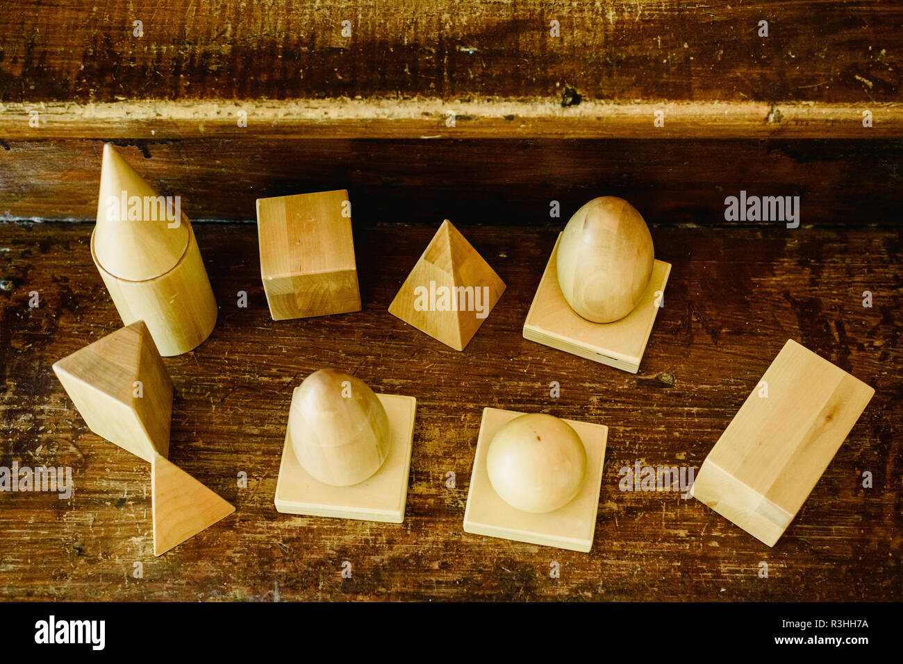 Solid wood shapes to study geometry and volumes, cones, triangles ...
