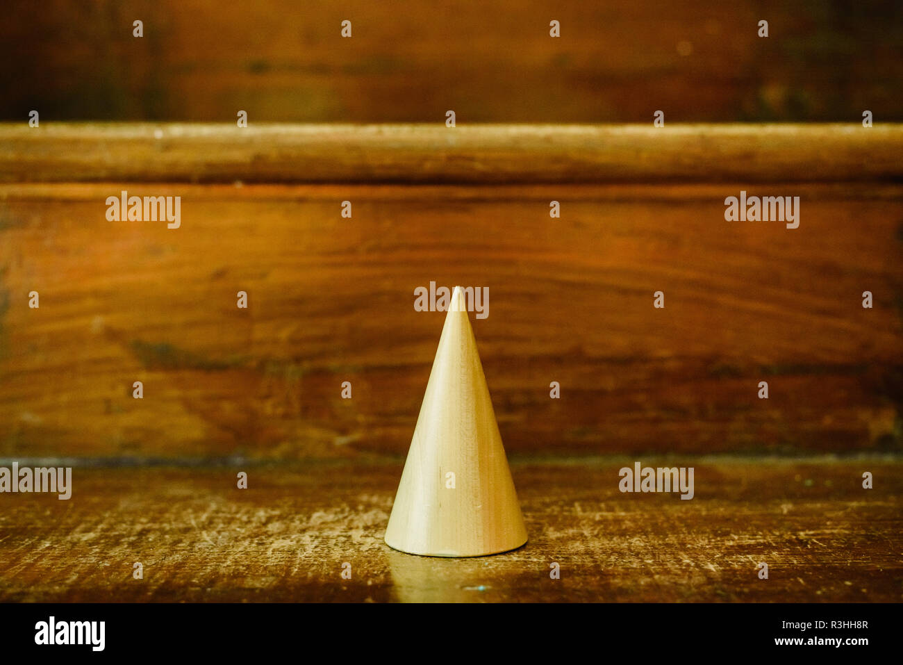 Cone shapes of solid wood to study geometry Stock Photo - Alamy