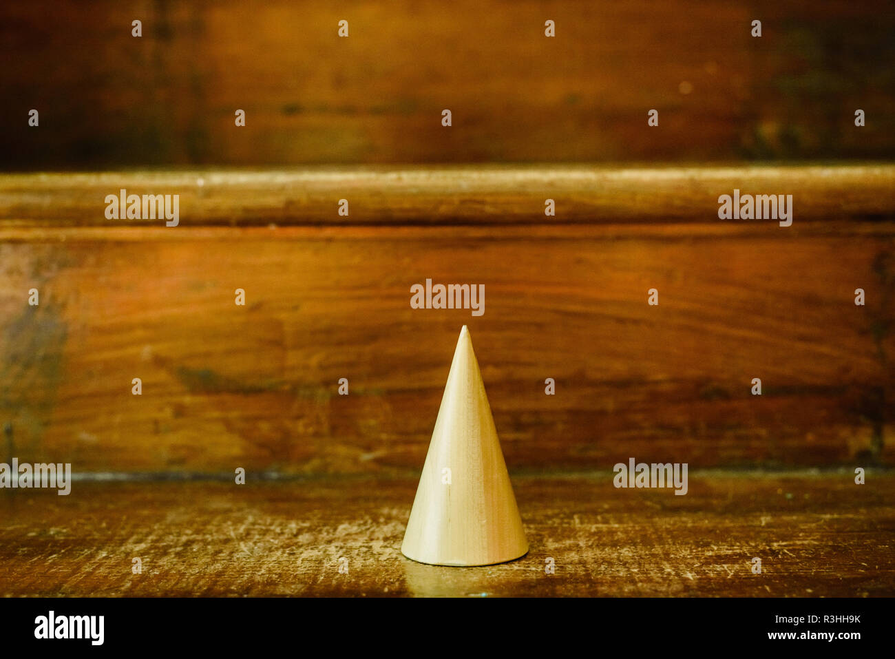 Cone shapes of solid wood to study geometry Stock Photo - Alamy