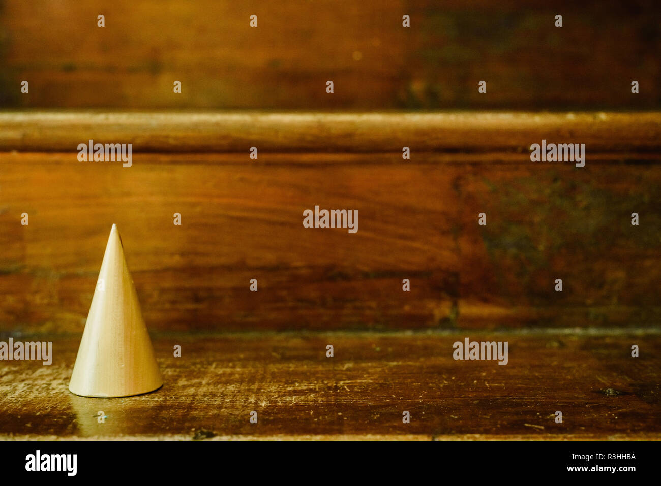 Cone shapes of solid wood to study geometry Stock Photo - Alamy
