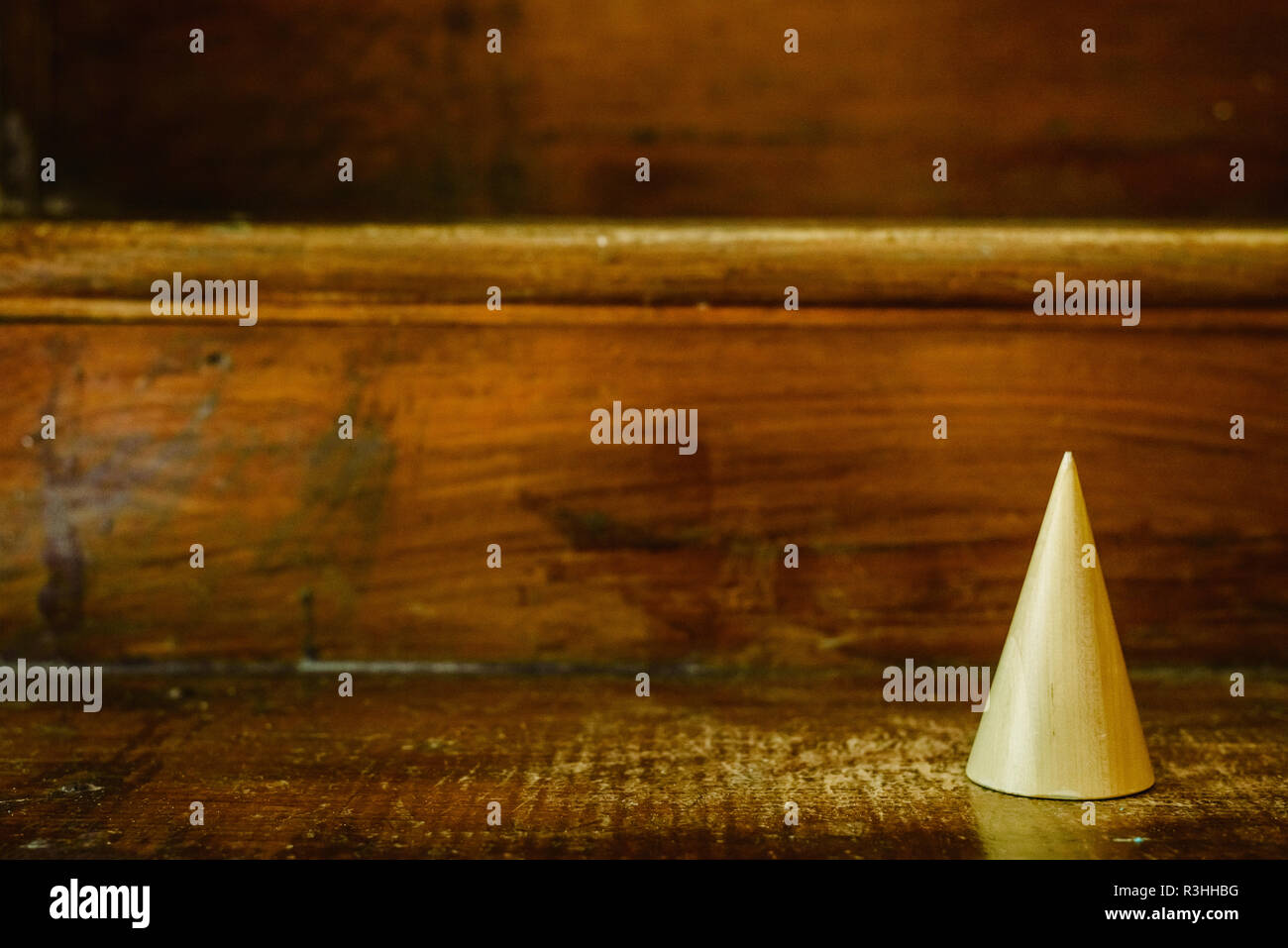 Cone shapes of solid wood to study geometry Stock Photo - Alamy