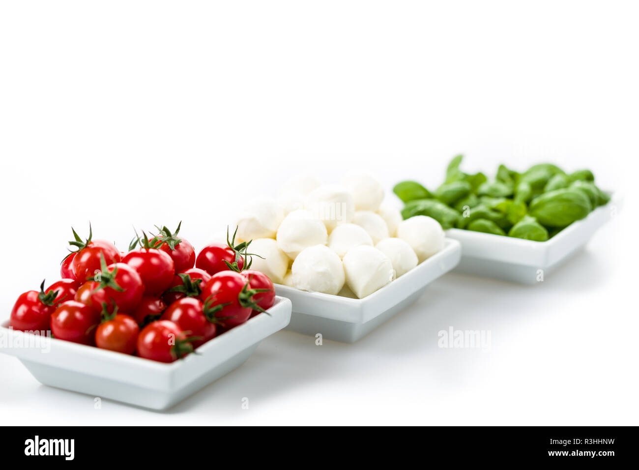 Fresh basil tomatoes salt Cut Out Stock Images & Pictures - Alamy