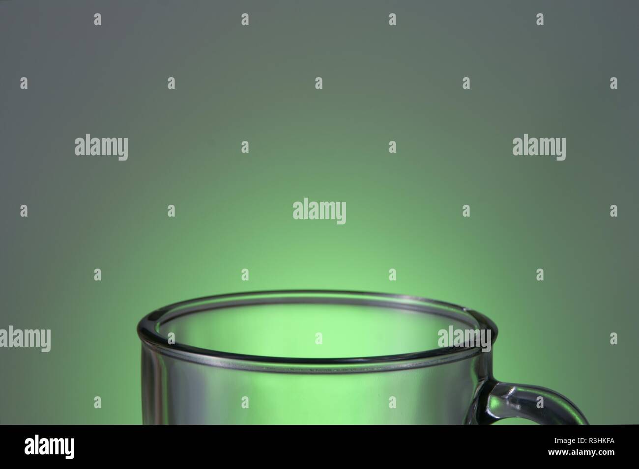 empty tea glass green background Stock Photo - Alamy