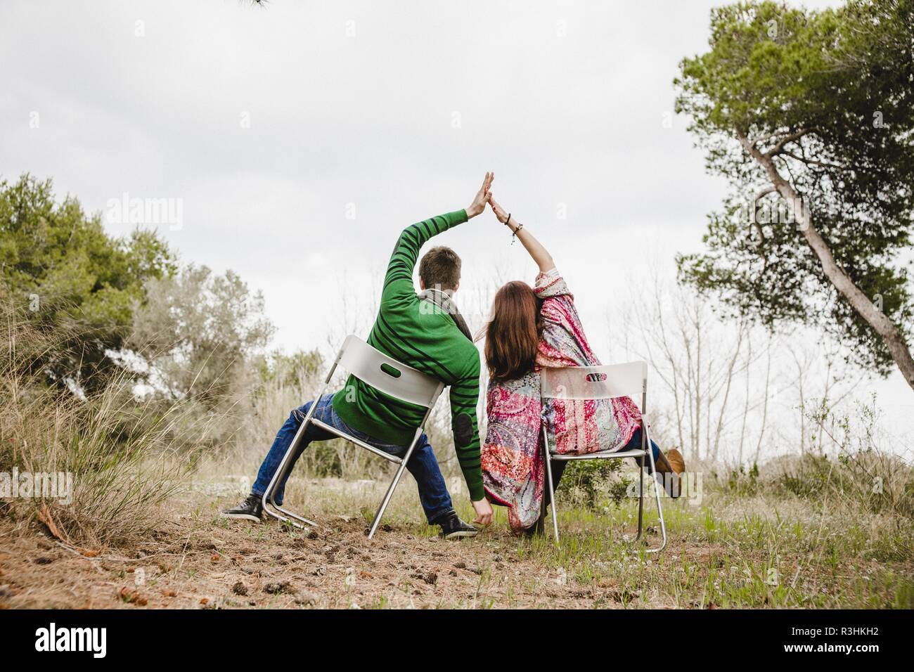 Hands on back of park chair hi-res stock photography and images - Alamy