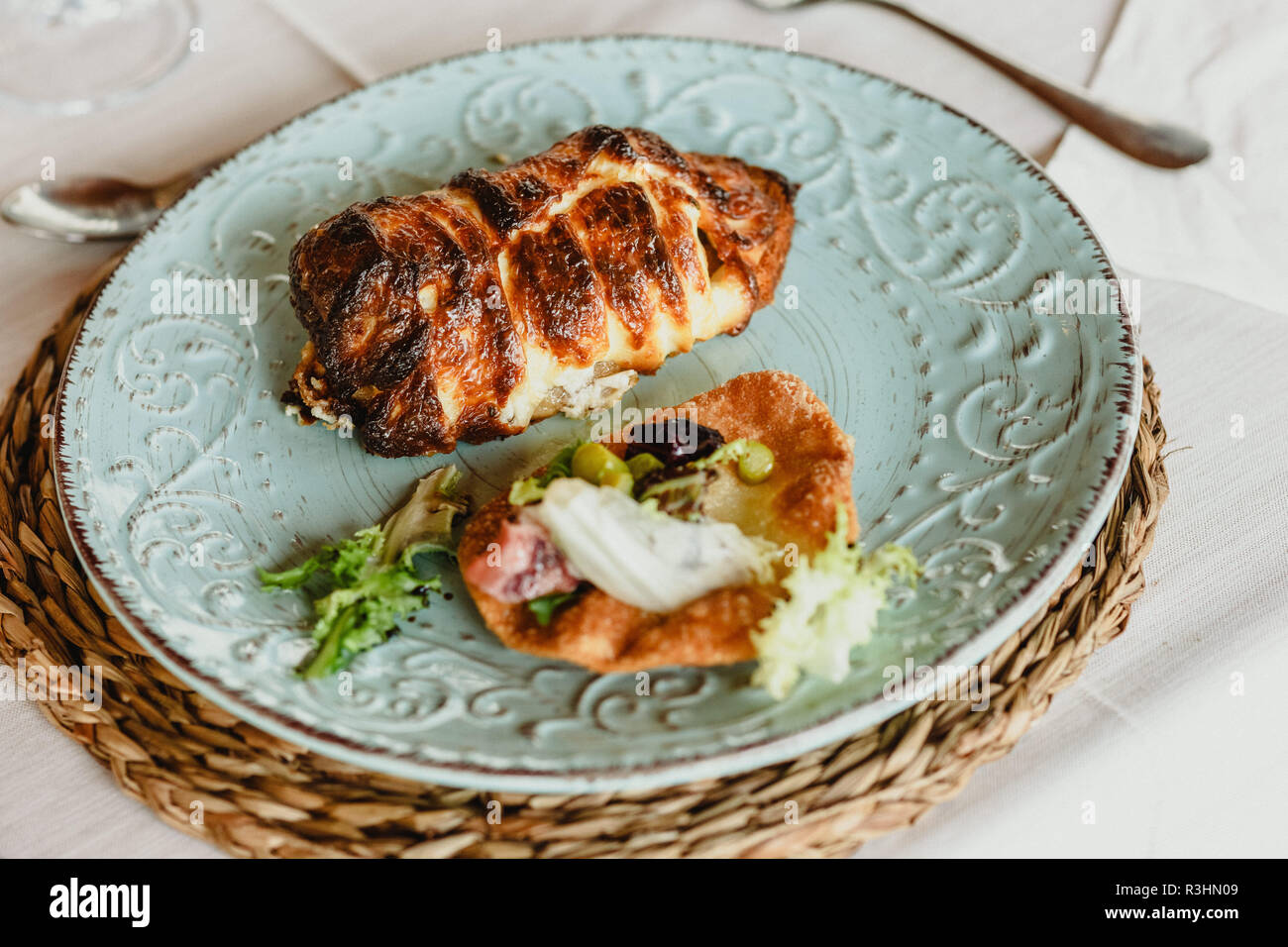 Main dish cooked with meat and garnish Stock Photo - Alamy