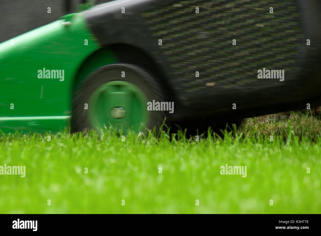 lawn mower in action Stock Photo - Alamy