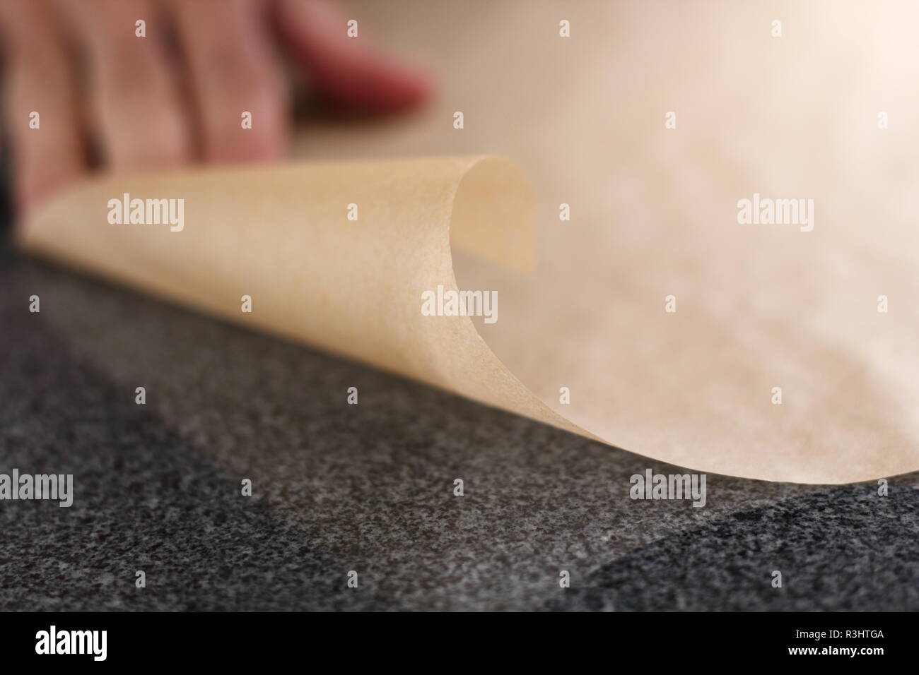 Chef unfold parchment paper Stock Photo - Alamy