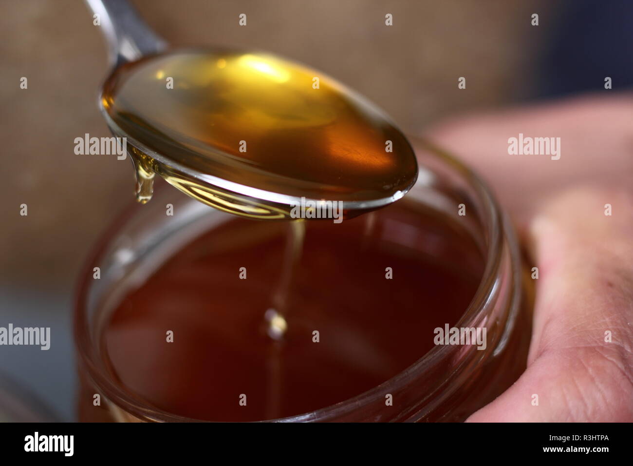 Adding golden syrup into pan with filling ingredients. Making Boston ...