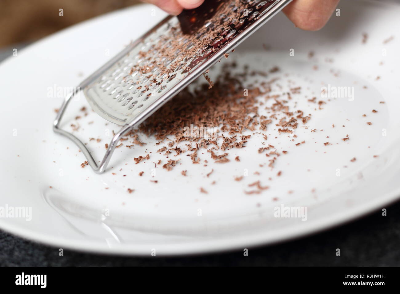 Grate Chocolate Bar Using Handheld Grater. Making Boston Banoffee Pie ...