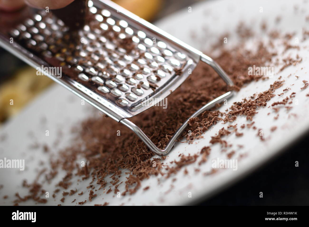 Grate Chocolate Bar Using Handheld Grater. Making Boston Banoffee Pie ...