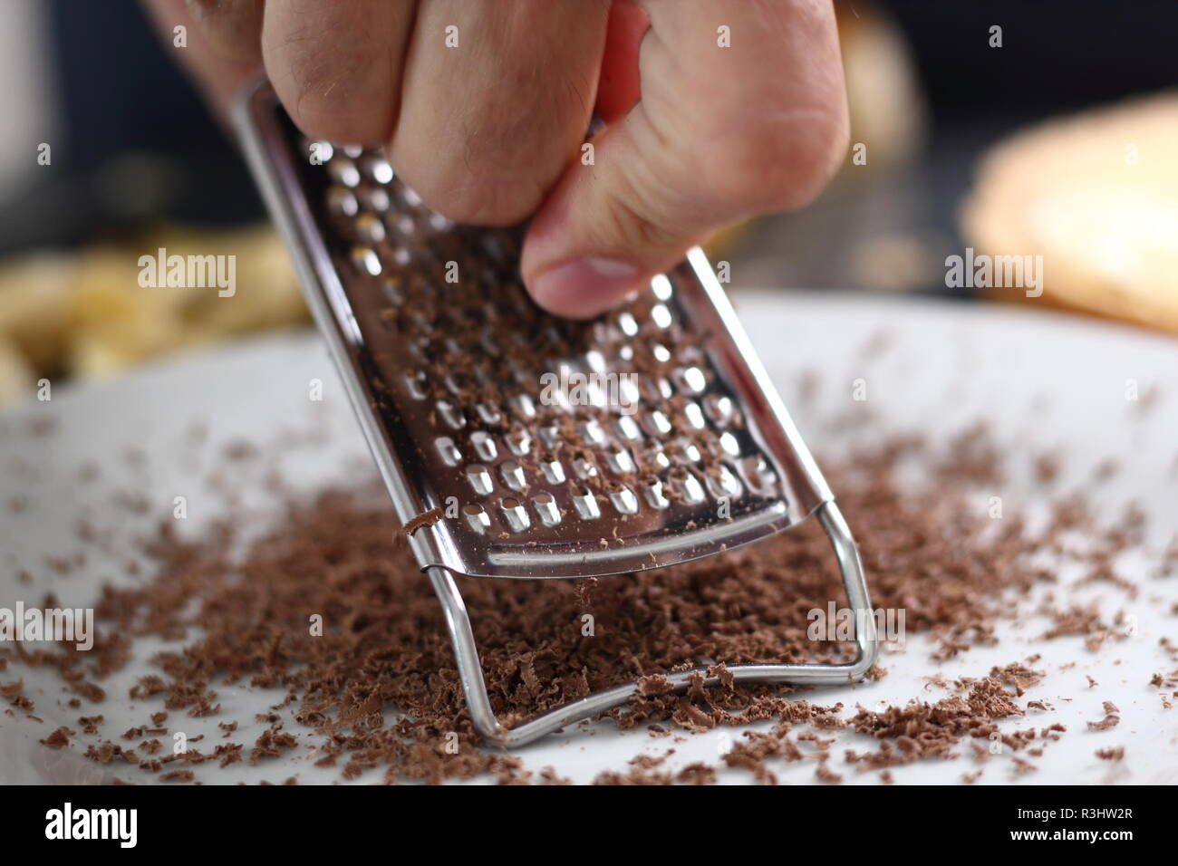 Grate Chocolate Bar Using Handheld Grater. Making Boston Banoffee Pie ...