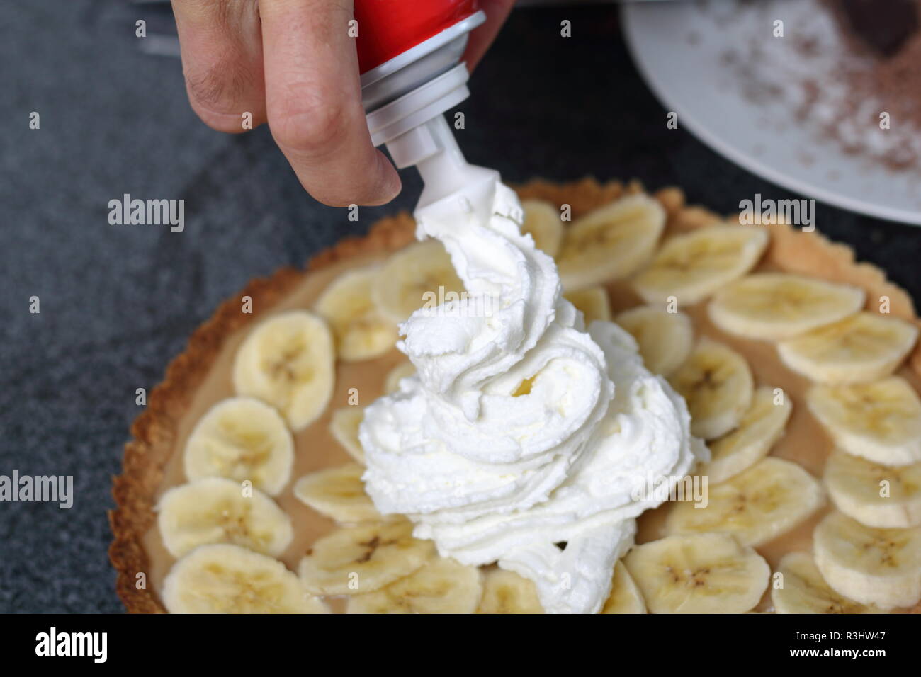 Pipe Whipped Cream in Center Filling. Making Boston Banoffee Pie Stock ...