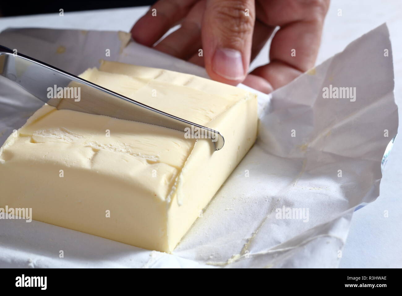 Cutting Butter Block in Half. Making Treacle Pie Series Stock Photo - Alamy