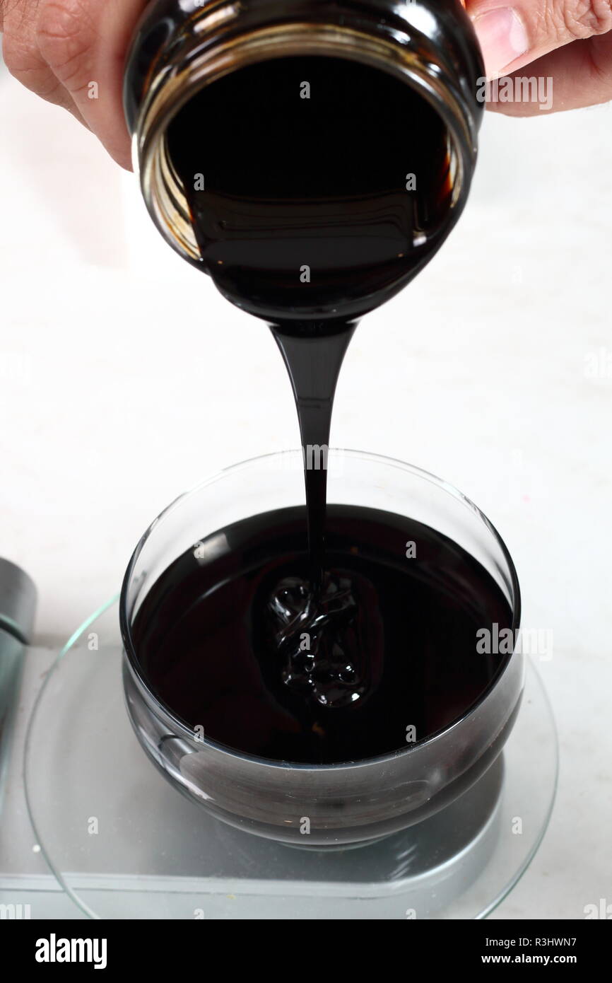 Weighing Molasses. Making Treacle Pie Series Stock Photo - Alamy