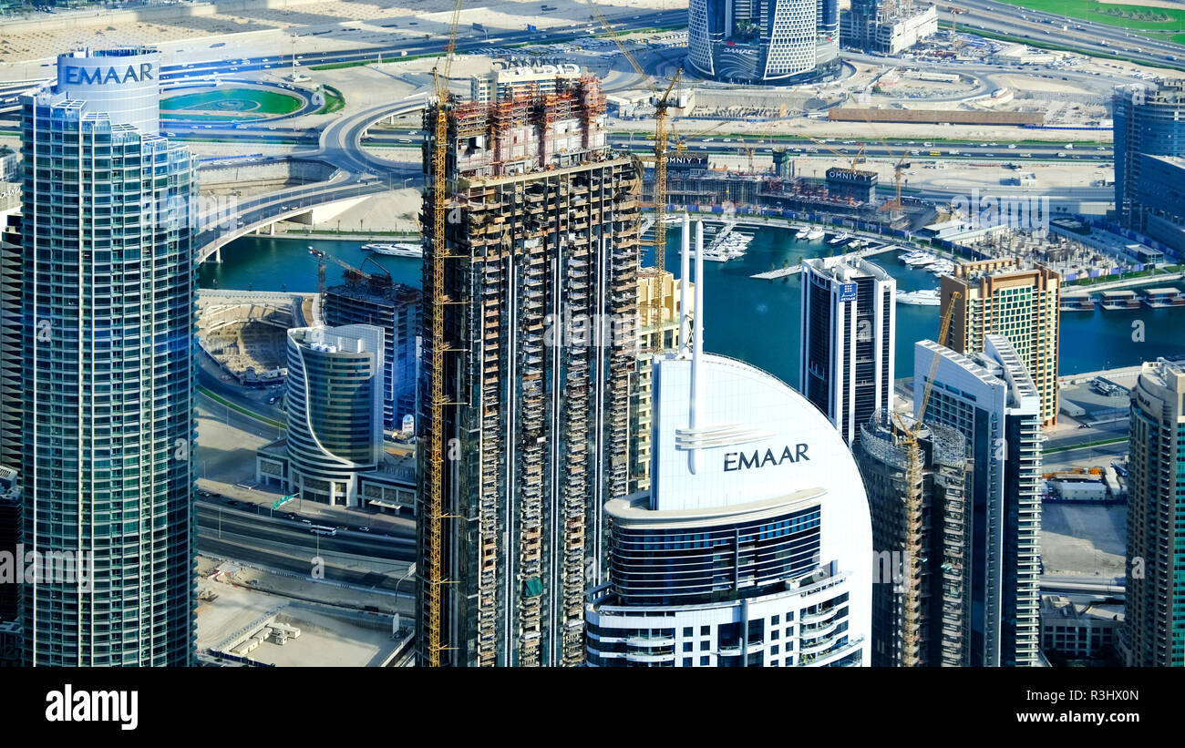 Standing on the Burj Khalifa tower in Dubai city and looking at the ...