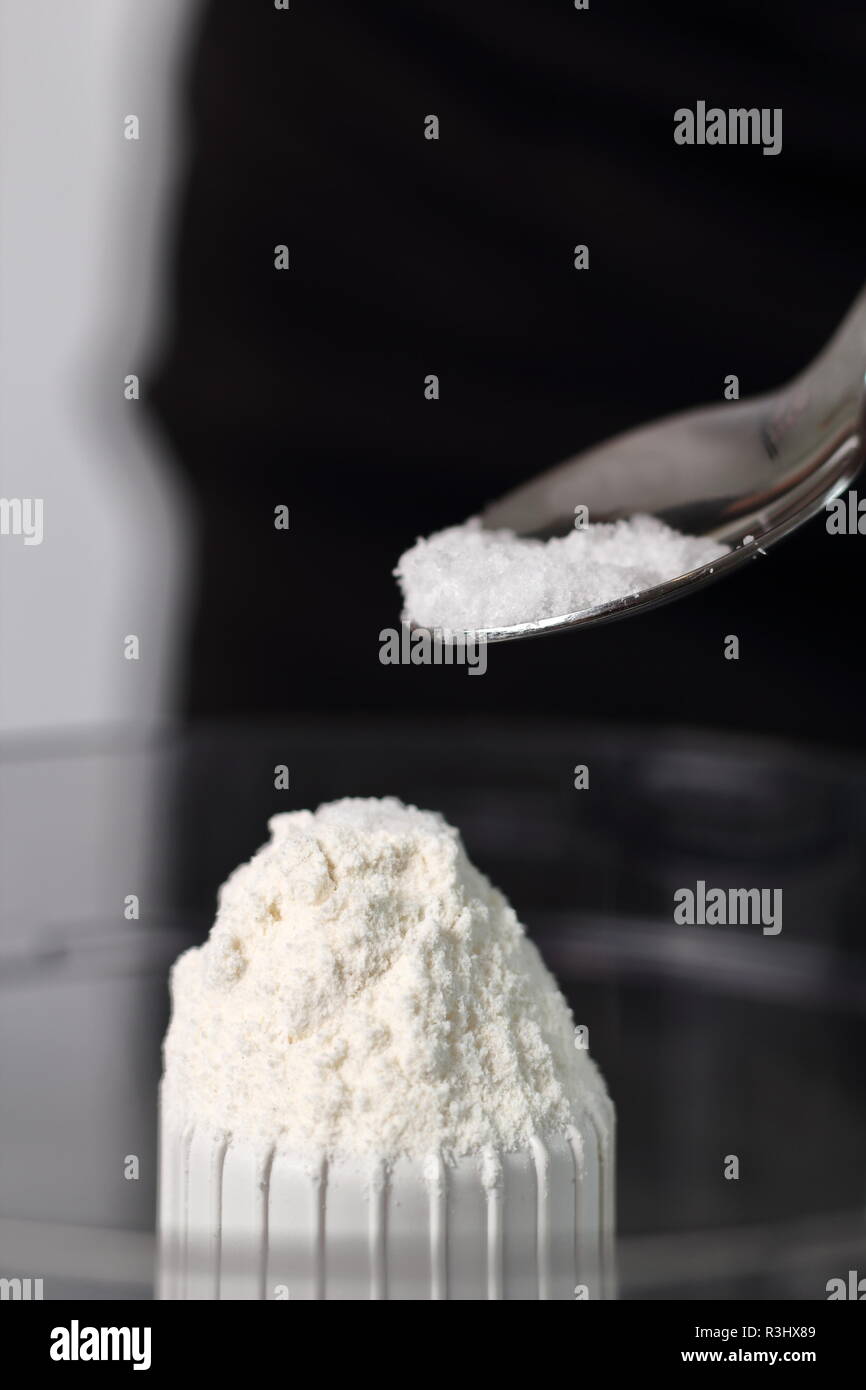 Add salt into flour. Making Shoofly Tart Series Stock Photo - Alamy