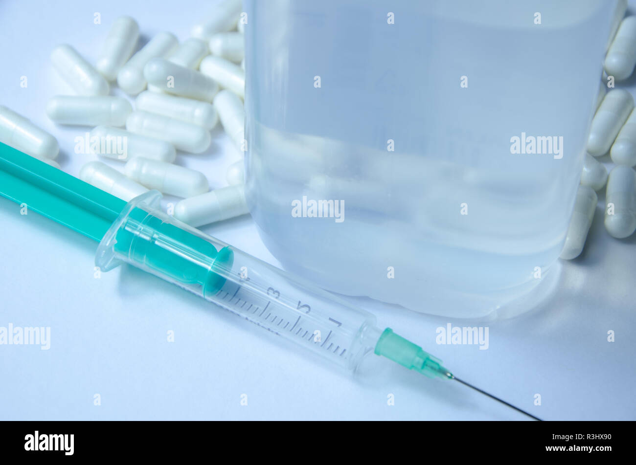 syringe with medicine bottle and tablets Stock Photo - Alamy