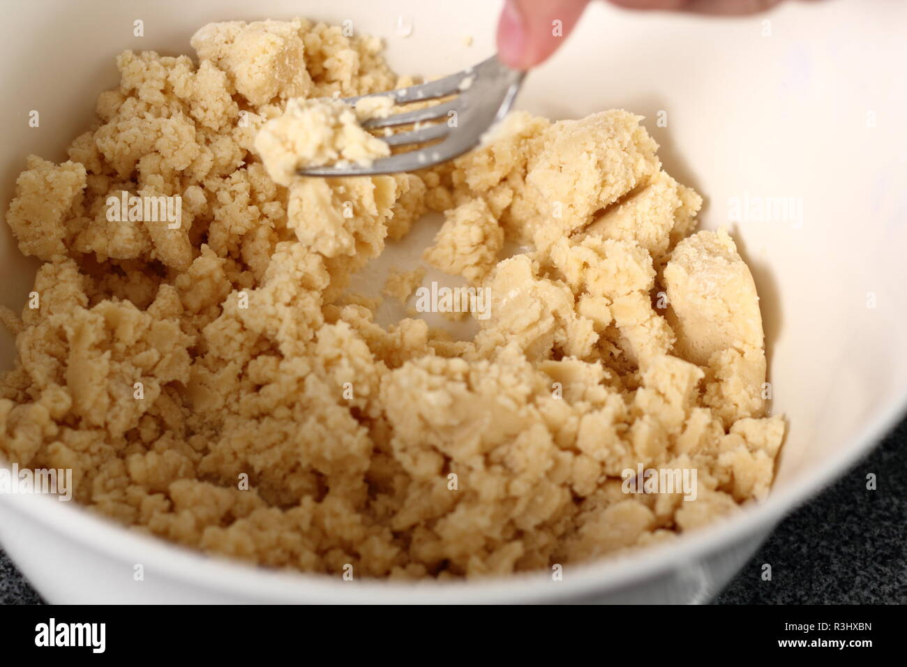 Stirring dough with water. Making Shoofly Tart Series Stock Photo - Alamy