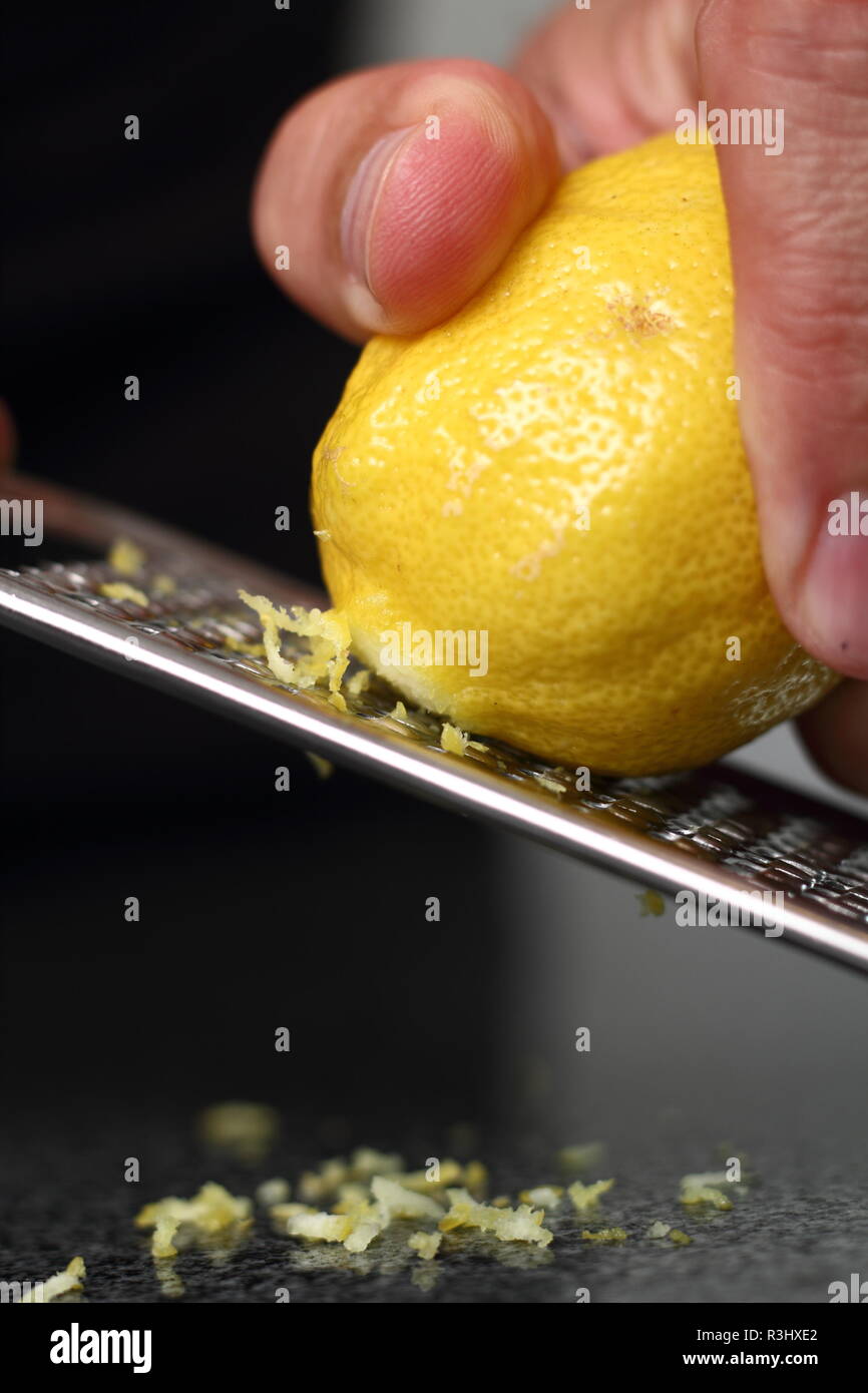 Grating lemon. Making Shoofly Tart Series Stock Photo - Alamy