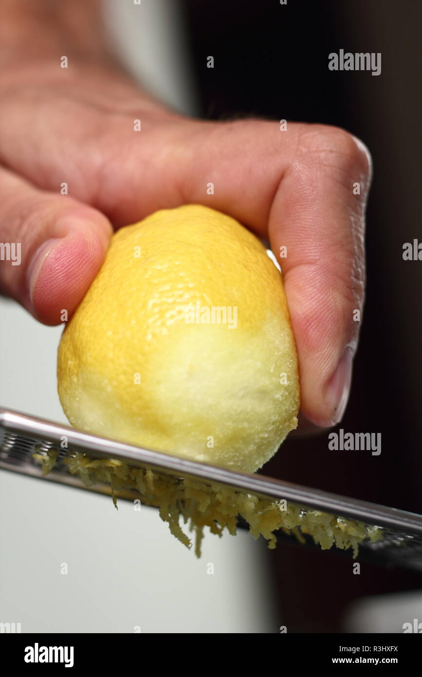 Grating lemon. Making Shoofly Tart Series Stock Photo - Alamy