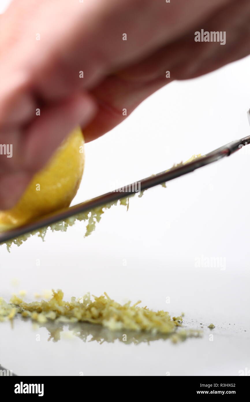 Grating lemon. Making Shoofly Tart Series Stock Photo - Alamy