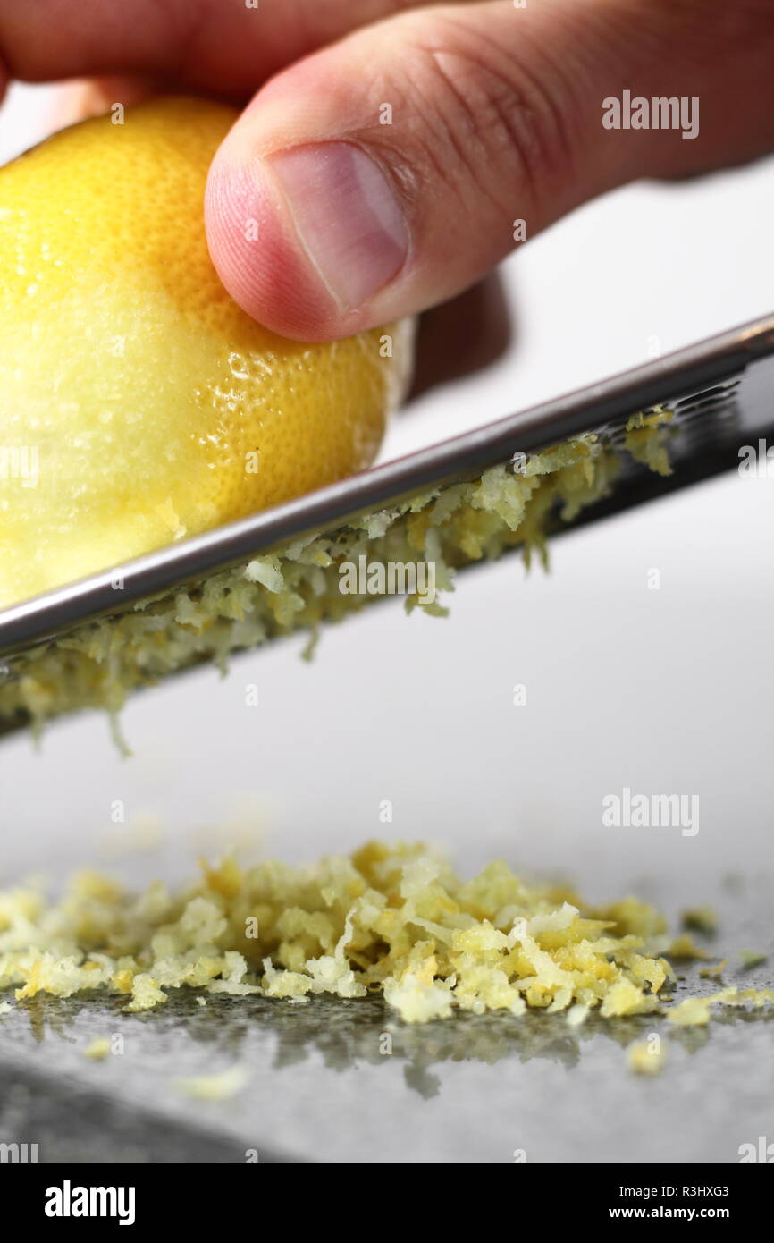 Grating lemon. Making Shoofly Tart Series Stock Photo - Alamy