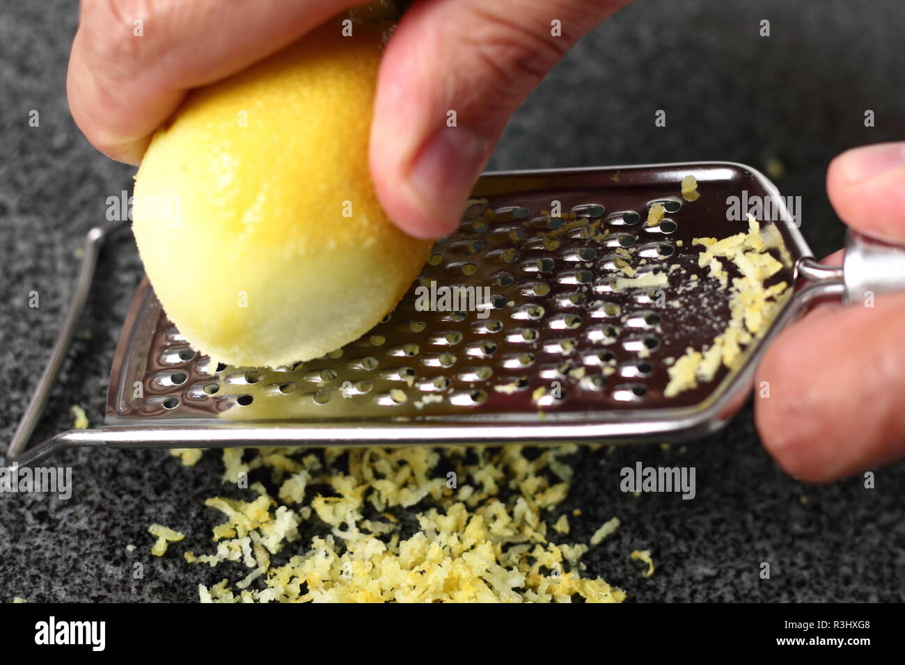 Grating lemon. Making Shoofly Tart Series Stock Photo - Alamy
