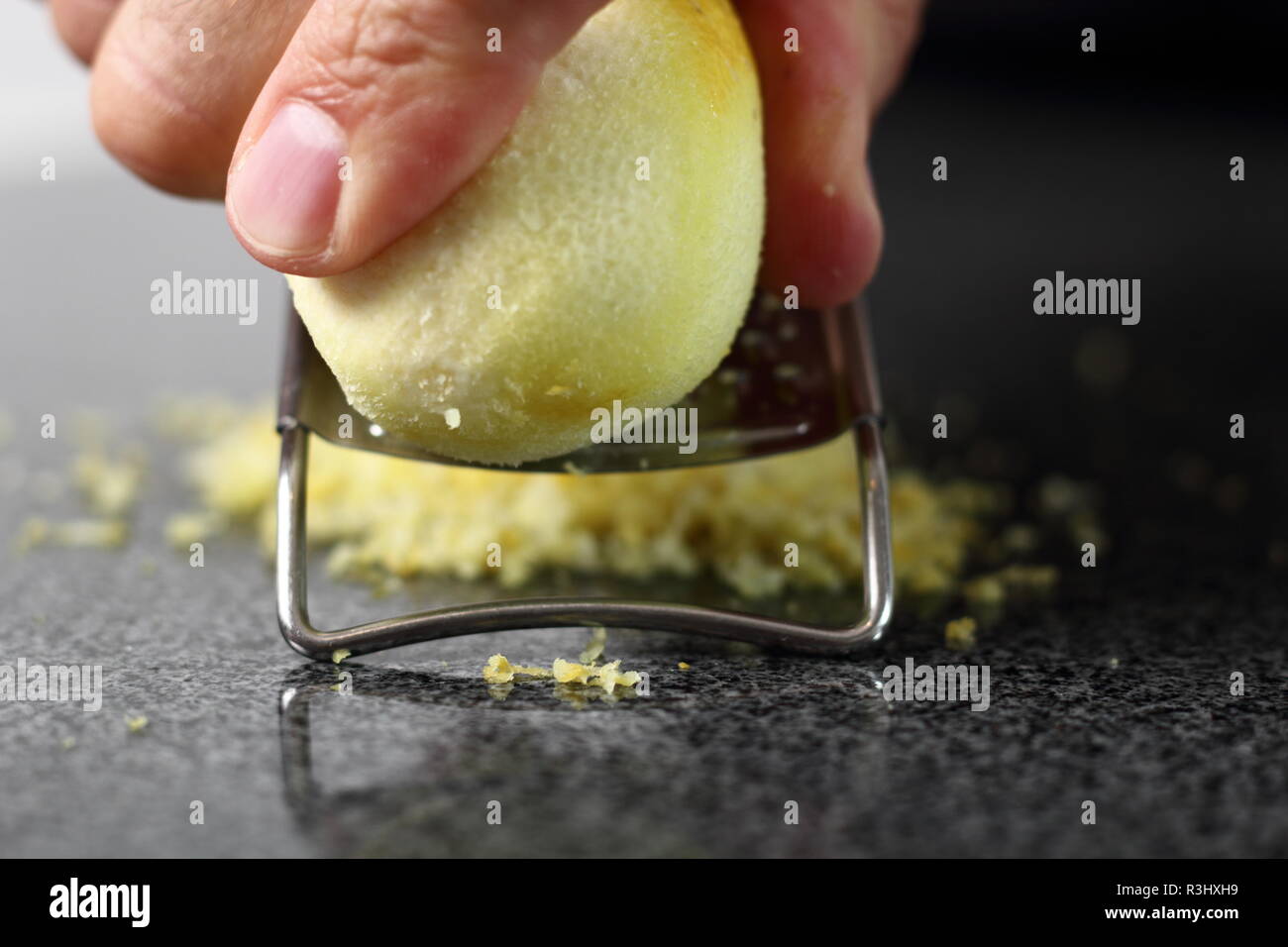 Grating lemon. Making Shoofly Tart Series Stock Photo - Alamy